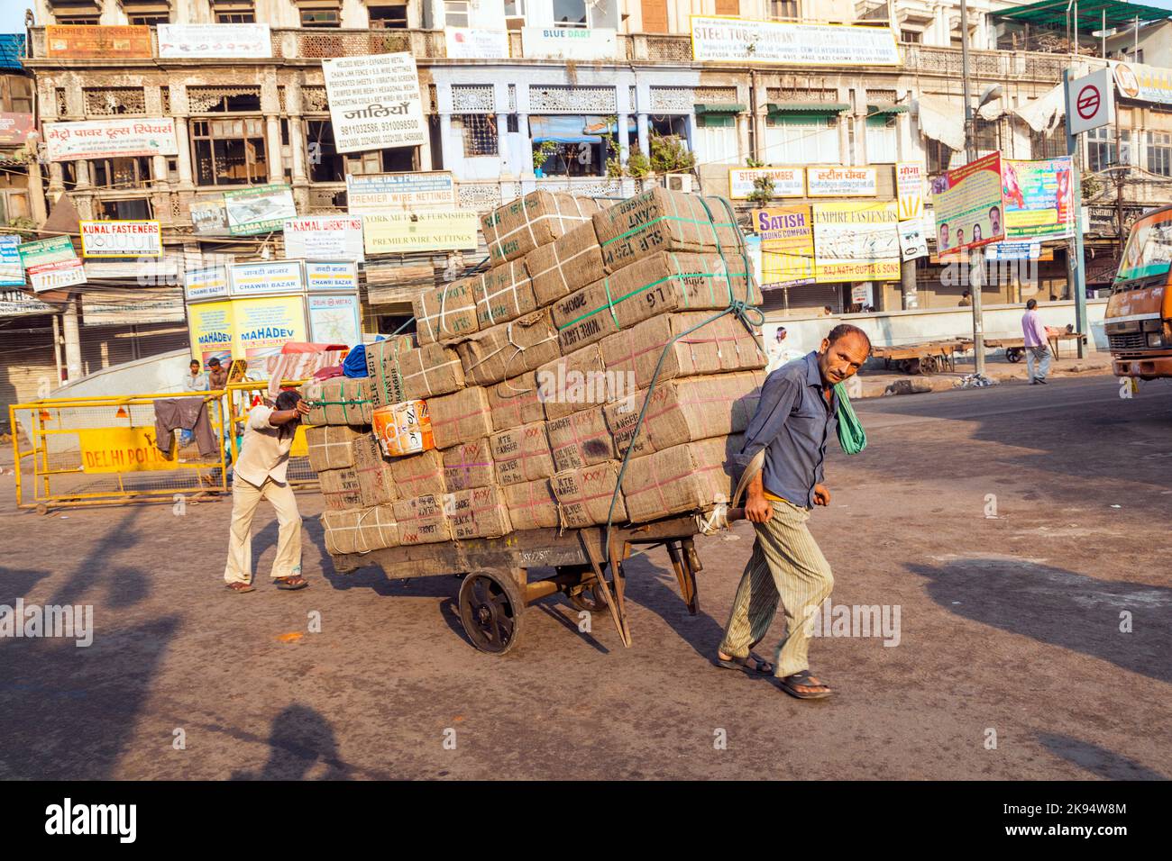 DELHI, INDIA - NOV 9: Rickshaw rider transports heavy goods early ...