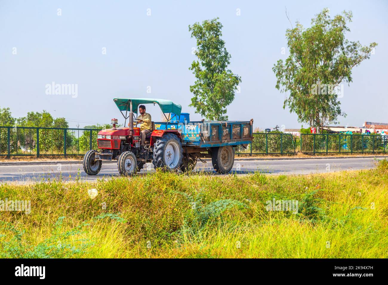 Indian farmer driving tractor hi-res stock photography and images - Alamy