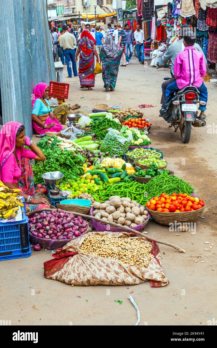 PUSHKAR, INDIA -OCTOBER 20: Unidentified vendors sell goods in a ...