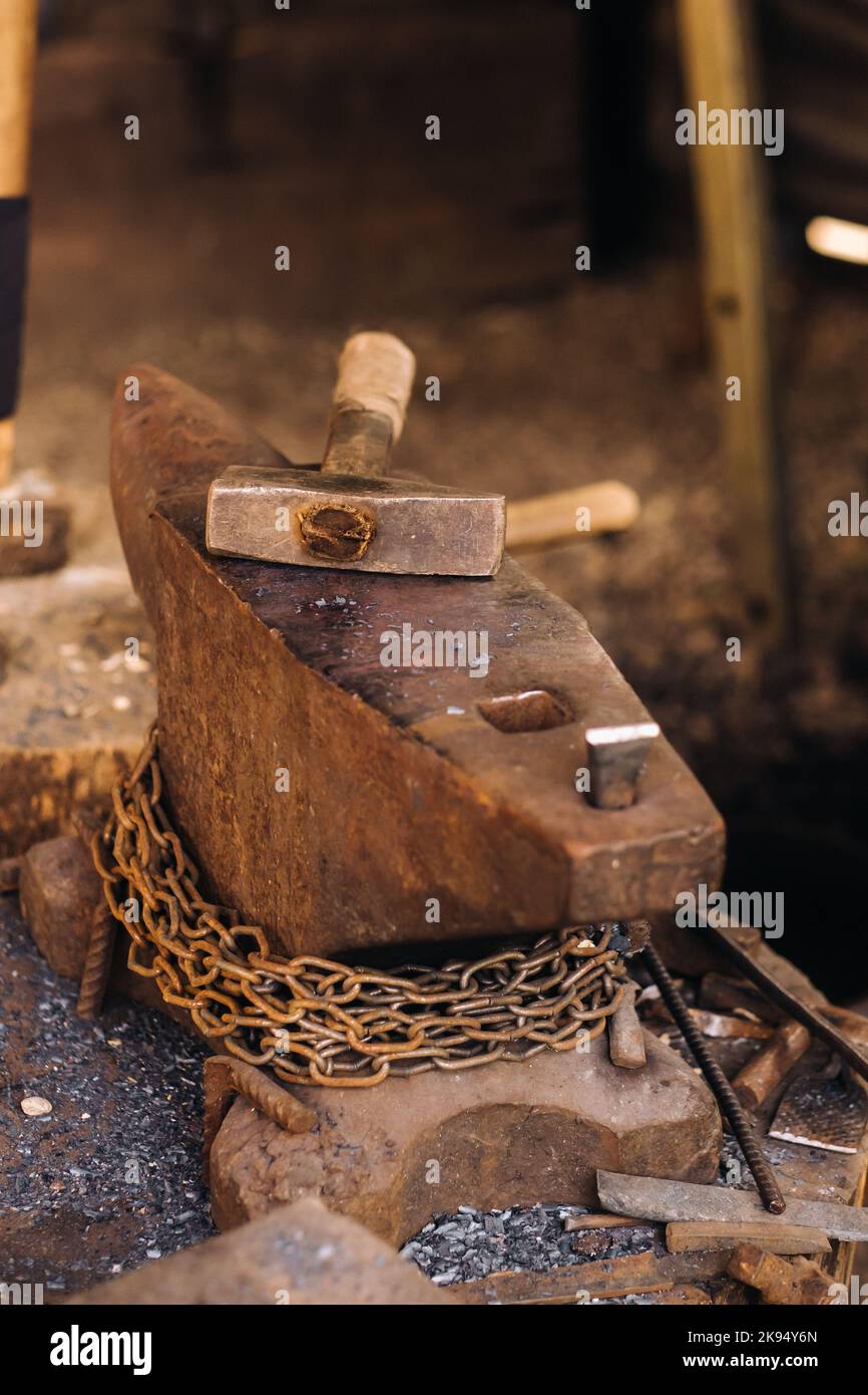 Forge, hammer on an anvil standing on the street Stock Photo - Alamy