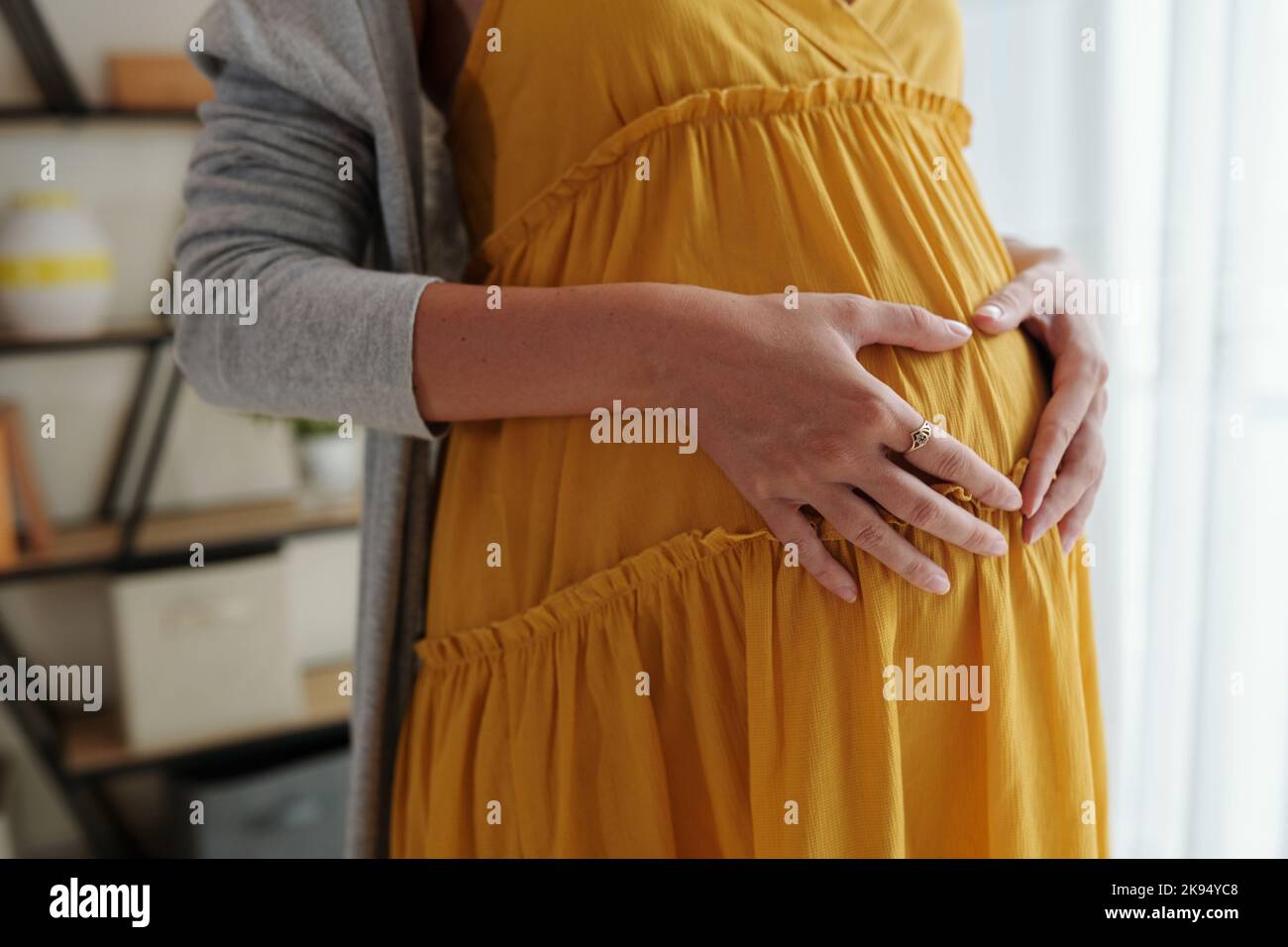 Closeup image of pregnant woman keeping hands on her belly Stock Photo ...