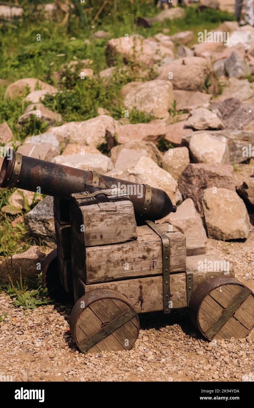 Medieval artillery piece on a wooden carriage standing outside in sunny ...