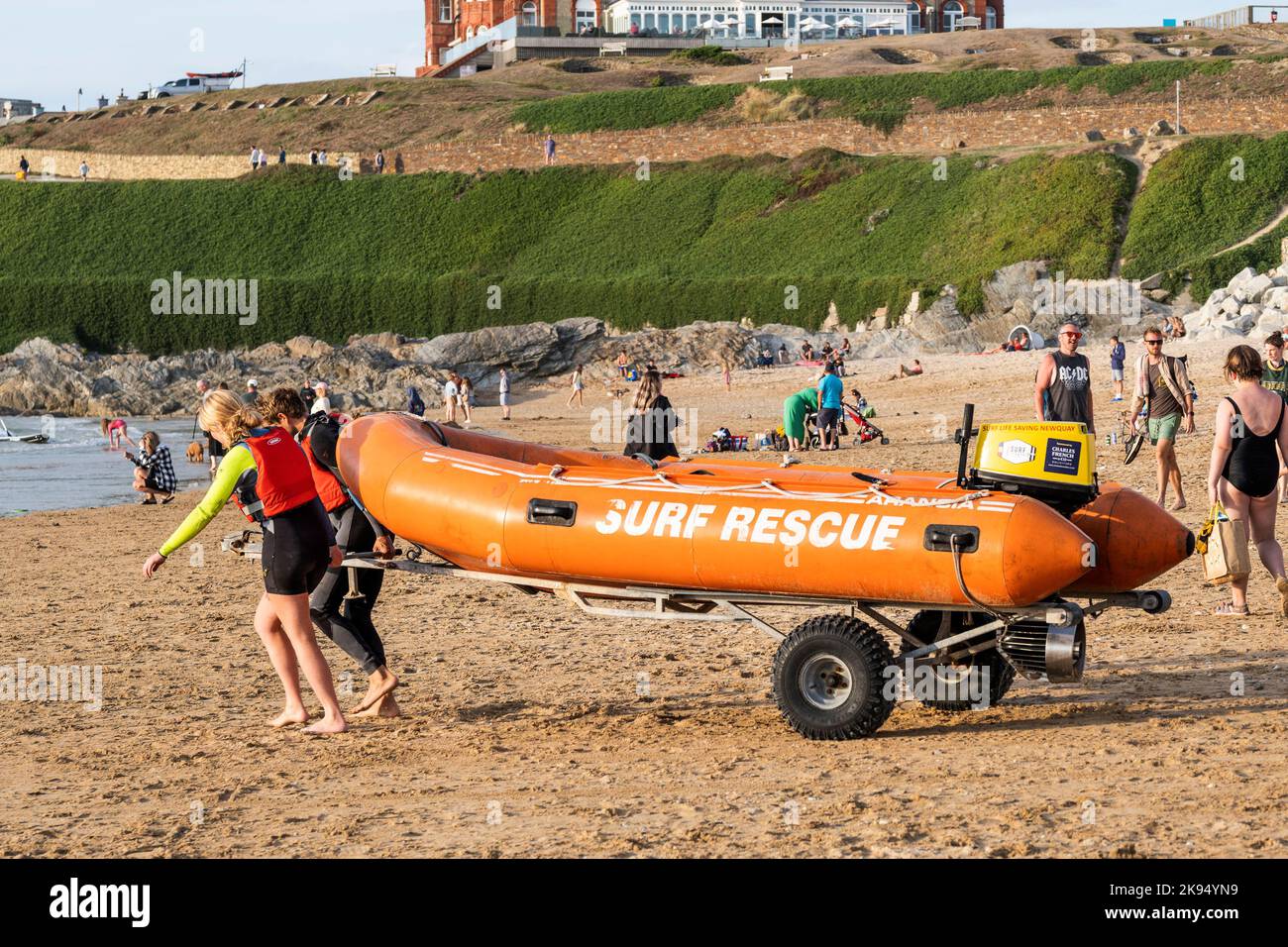 Members of Newquay Surf Life Saving Club pulling a trailer to launch an ... Members of Newquay Surf Life Saving Club pulling a trailer to launch an ...
