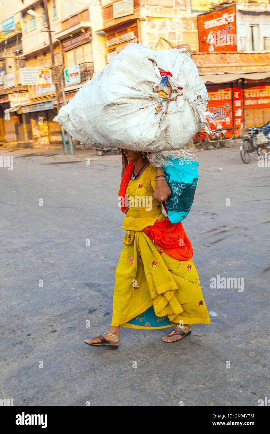 JODHPUR,INDIA - OCT 23: Indian woman carries heavy load on her head on ...