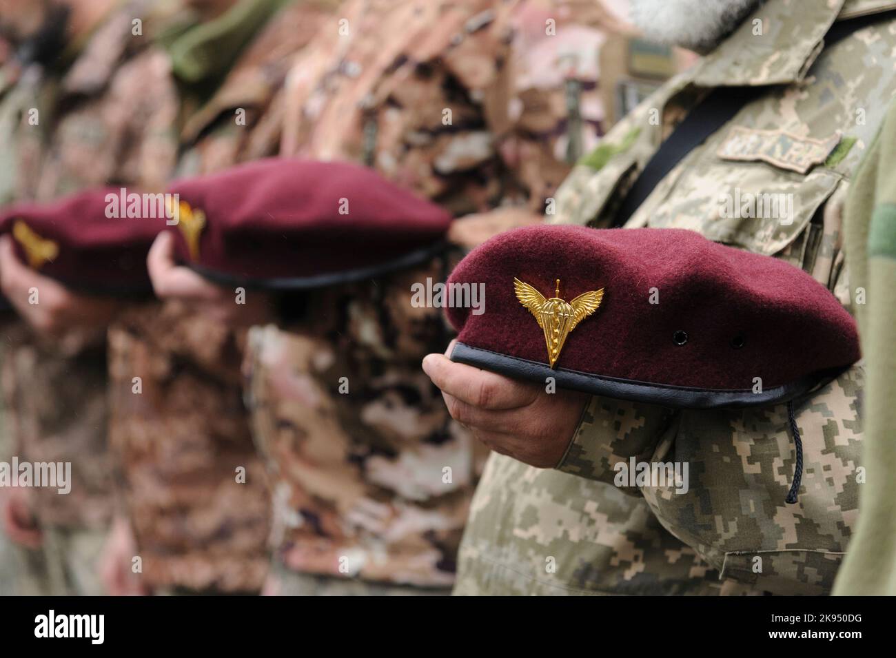 Lviv, Ukraine. 25th Oct, 2022. The paratroopers hold their caps out of ...