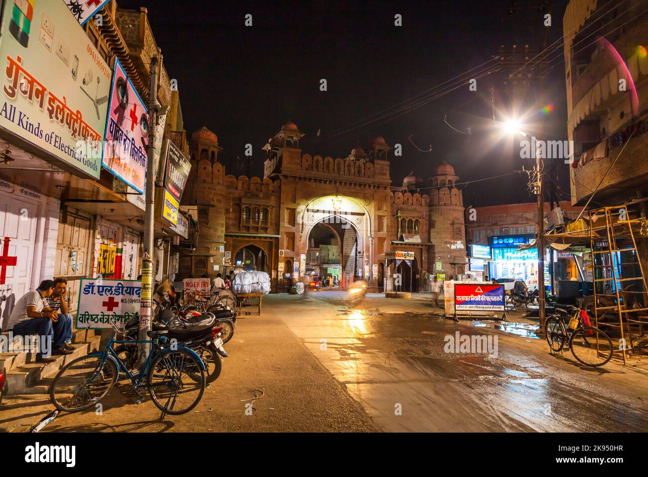 BIKANER, INDIA - OCT 23: people pass the ancient gate by night on ...