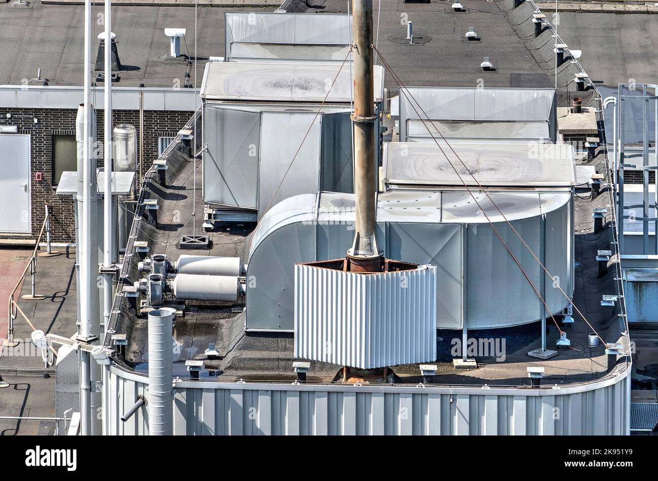 Ducts, pipes, lightning rods and other equipment on the roof of an ...