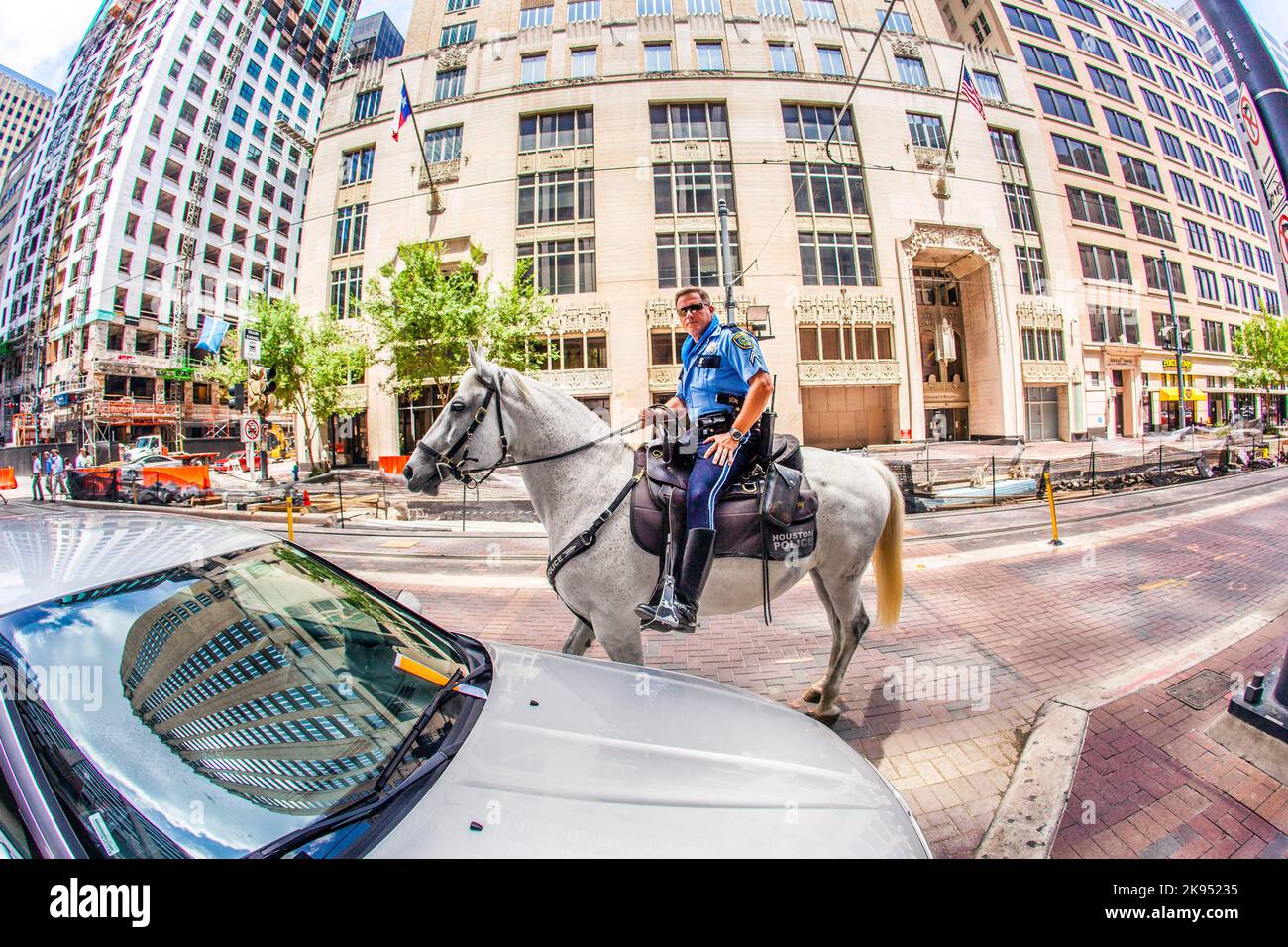 HOUSTON, USA - JULY 11: policeman on horse checks correct parking on ...