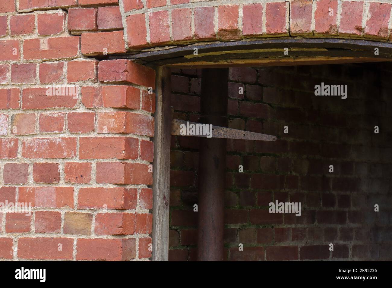 A red brick house with a rusty pipe Stock Photo - Alamy