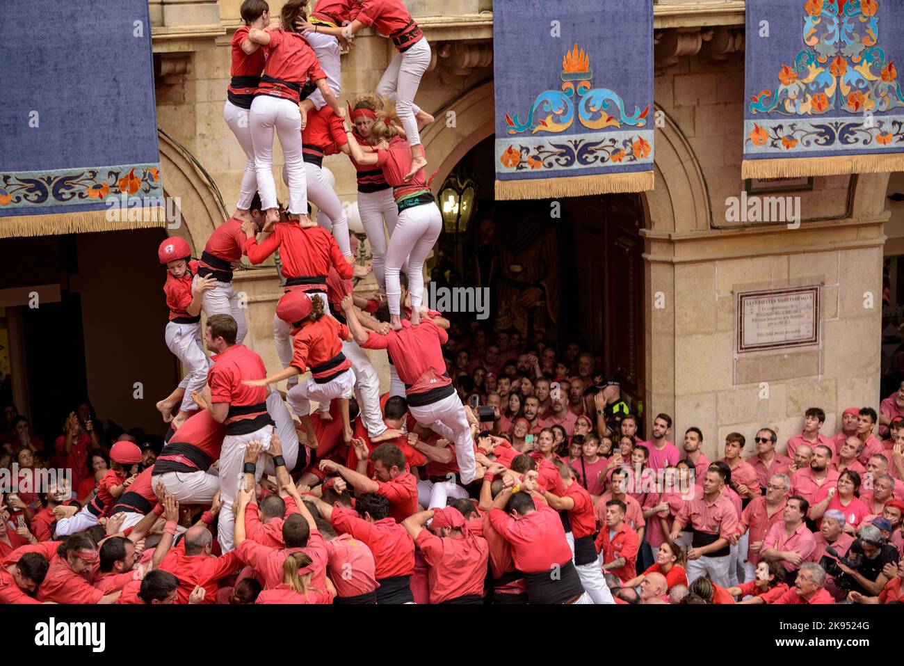 Fall of a Castell (human tower) "5 of 9" of the Colla Jove dels Xiquets ...