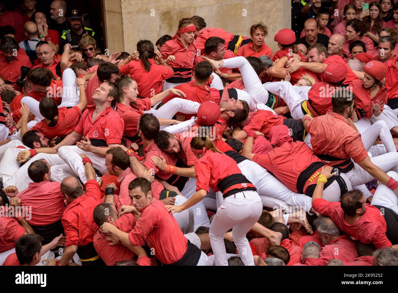 Fall of a Castell (human tower) "5 of 9" of the Colla Jove dels Xiquets ...