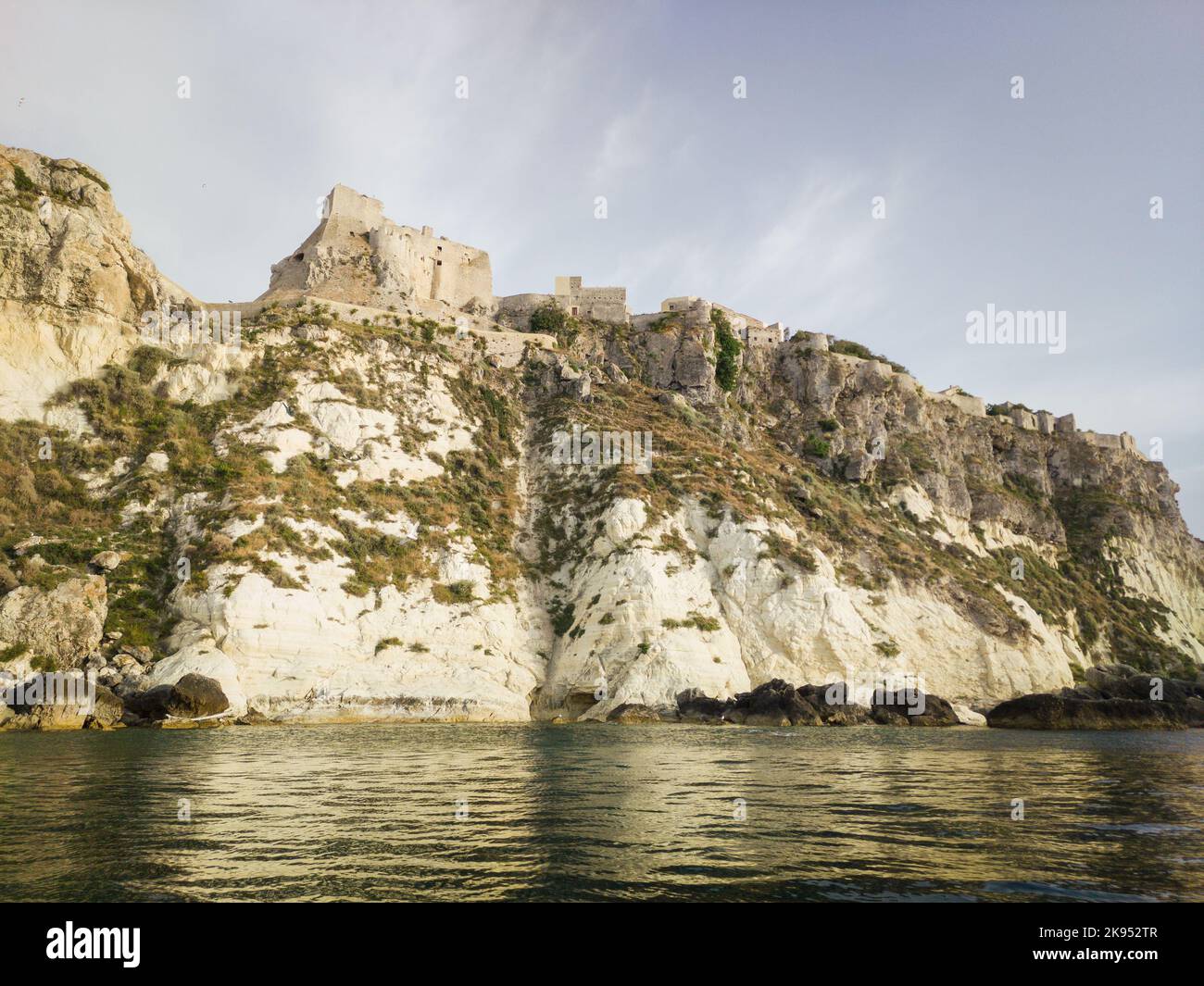 The historic castle ruins on a cliff over water at the Tremiti Islands ...