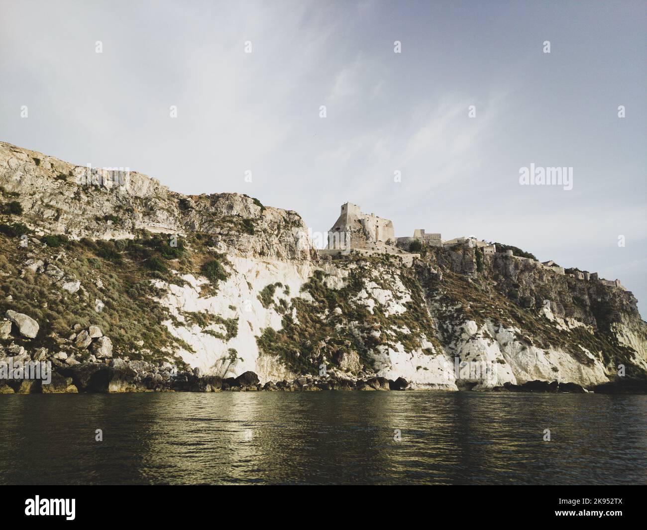 The historic castle ruins on a cliff over water at the Tremiti Islands ...