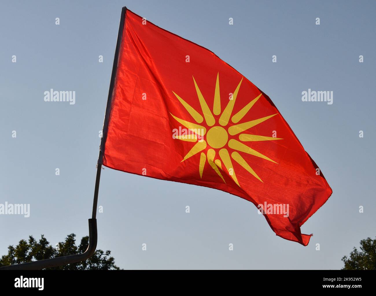 A view of the Macedonian flag on a blue sky background Stock Photo - Alamy