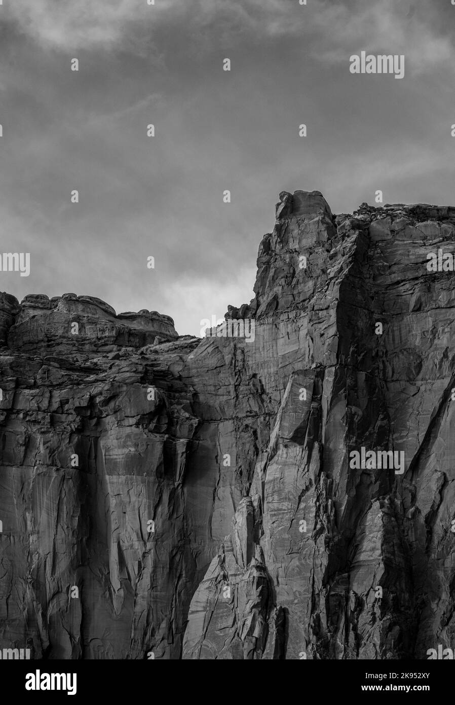 Sheer Cliffs Below Cloud Wisps in Black and White Stock Photo - Alamy