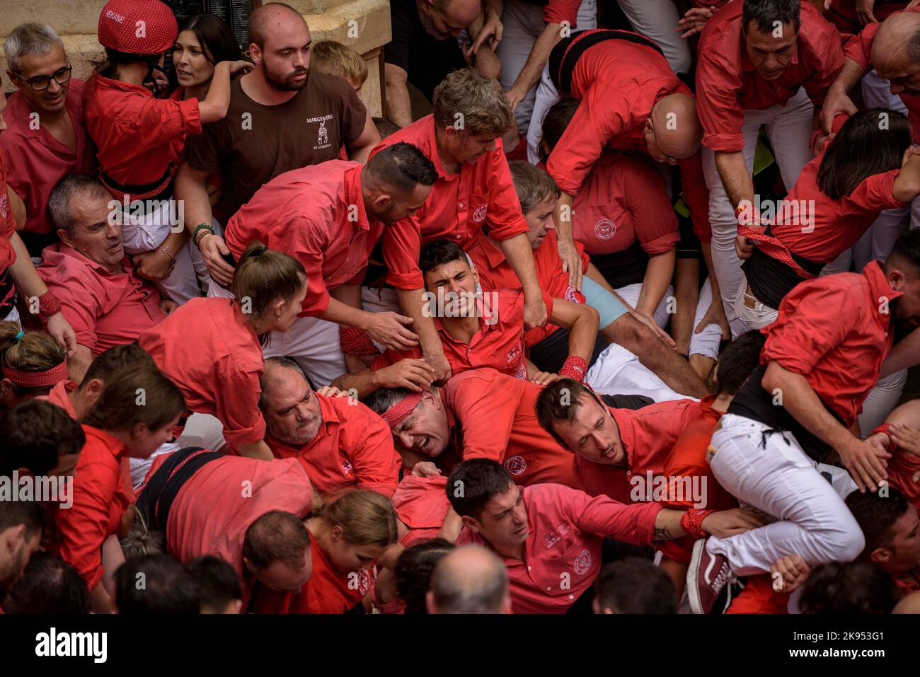 Fall of a Castell (human tower) "5 of 9" of the Colla Jove dels Xiquets ...
