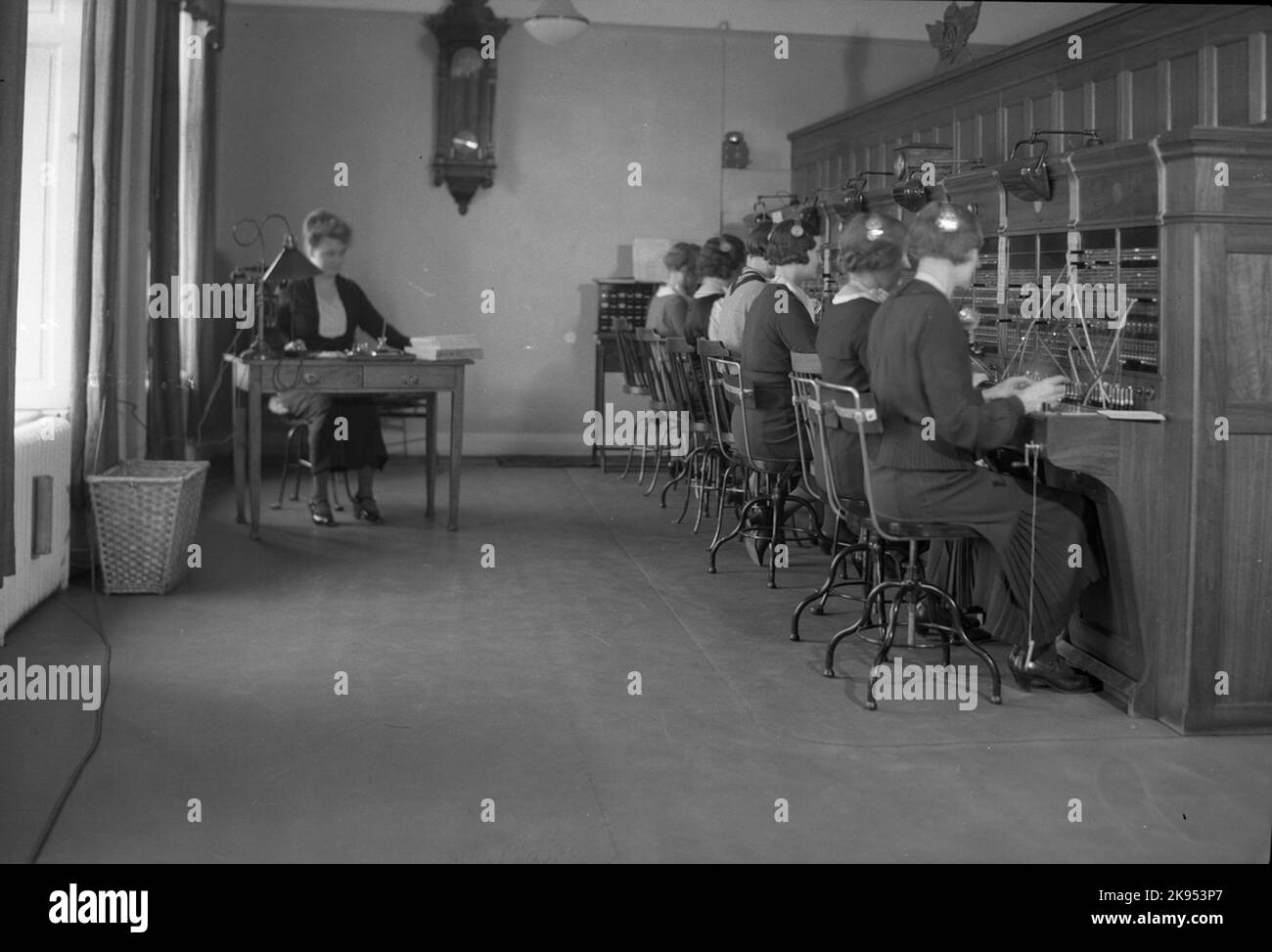 Telephone exchange with staff Stock Photo - Alamy