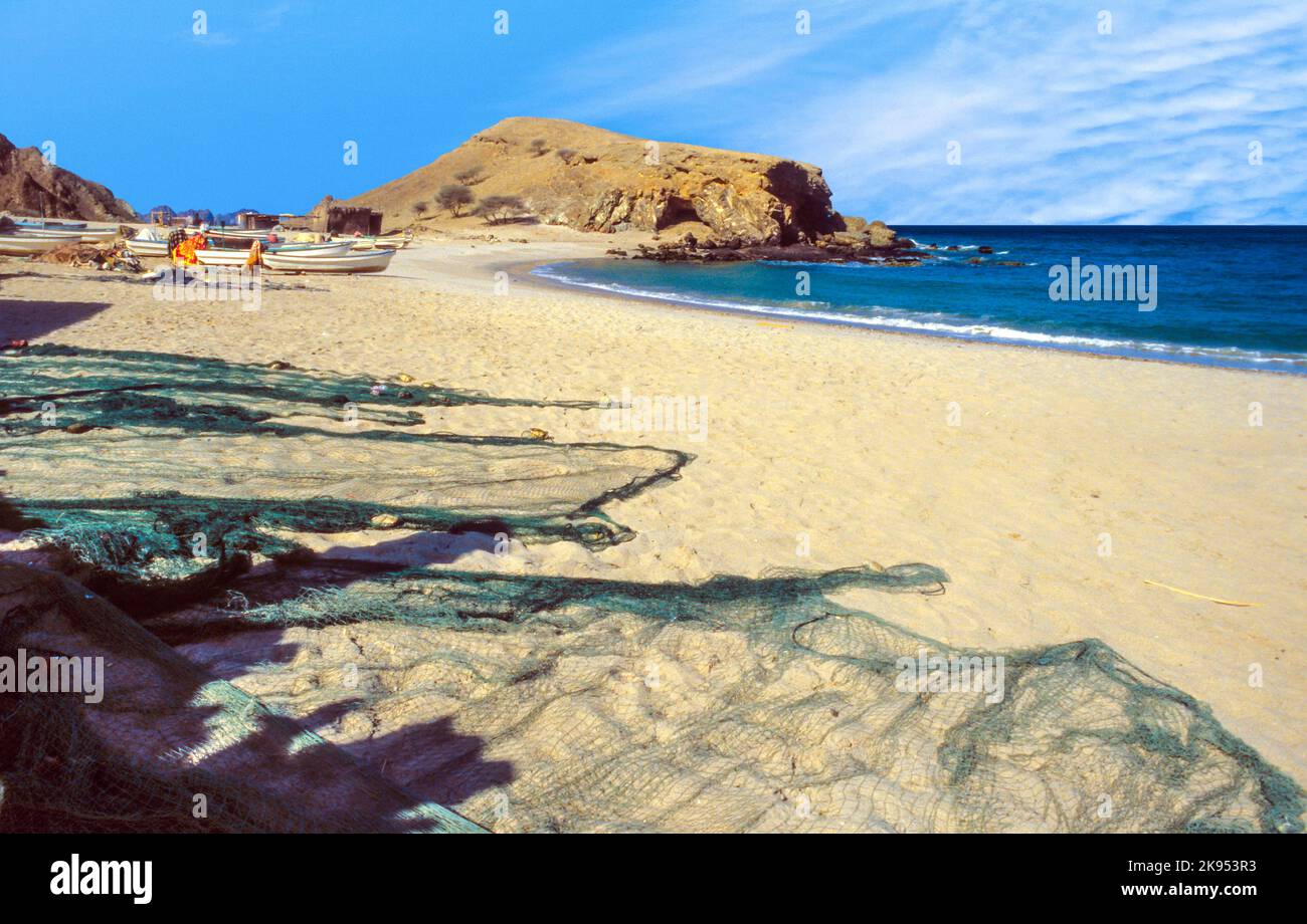 Quantab, Oman - July 4, 1993: boats and fishermens net at the beach of ...