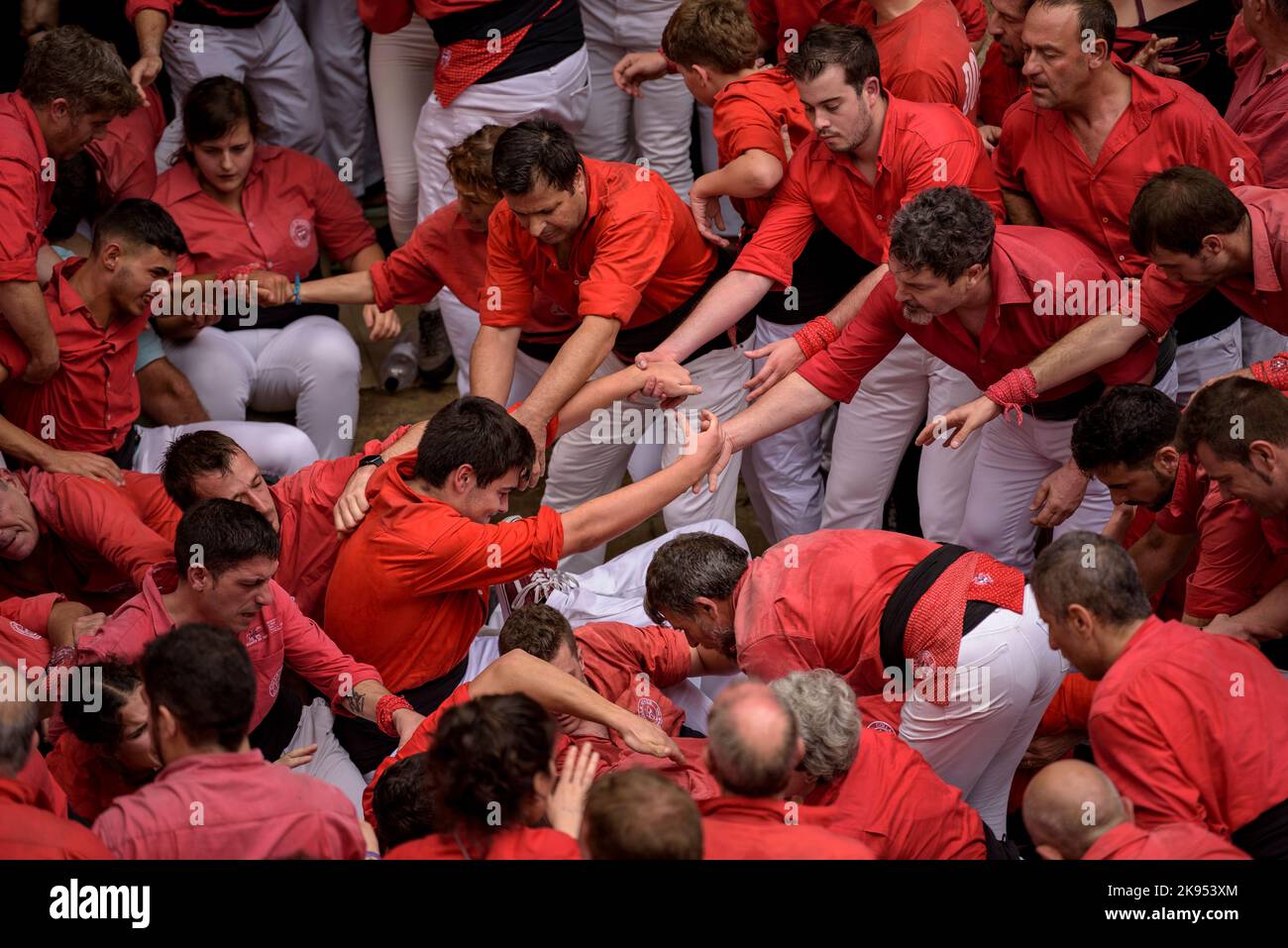 Fall of a Castell (human tower) "5 of 9" of the Colla Jove dels Xiquets ...