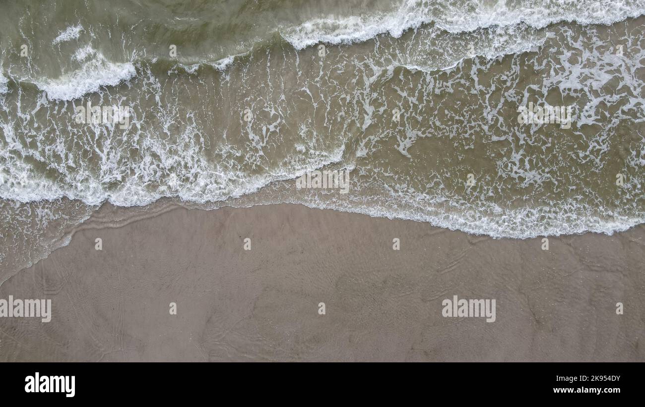 An aerial view of the splashing sea waves at the shore Stock Photo - Alamy