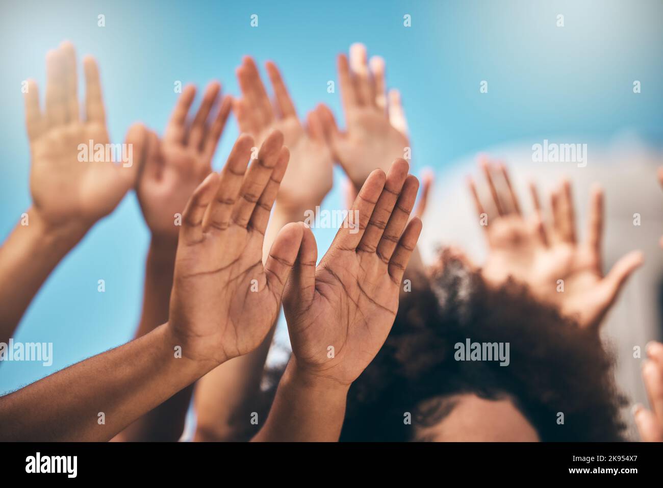 Pray, hands and people praying against blue sky, united for religion ...