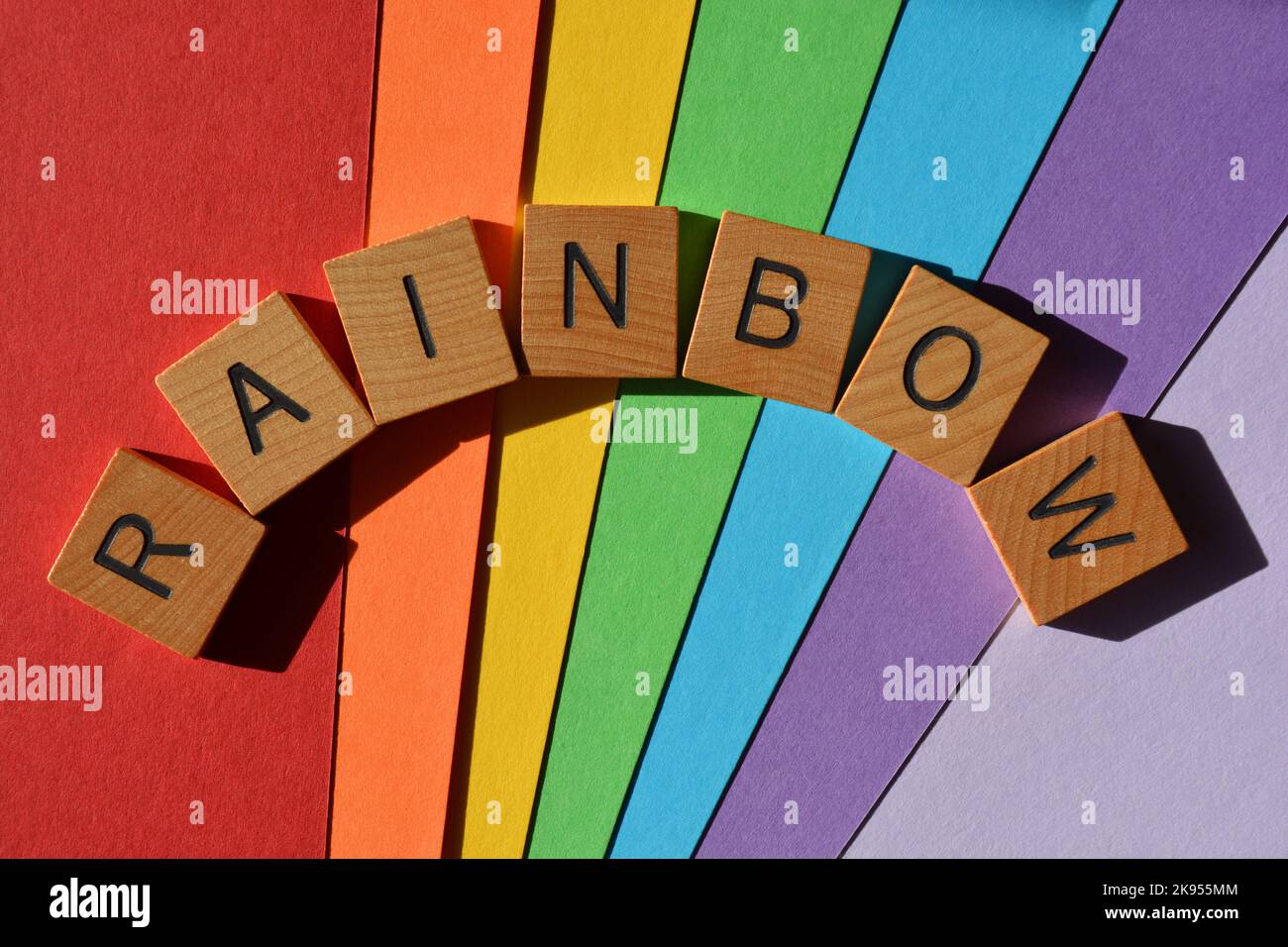 Rainbow, word in wooden alphabet letters isolated on multicoloured ...