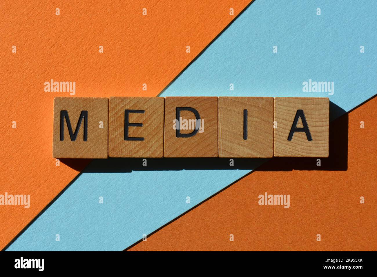 Media, word in wooden alphabet letters isolated on colourful background ...