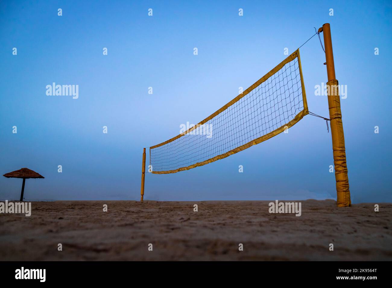 Beach volleyball net during early morning Stock Photo - Alamy