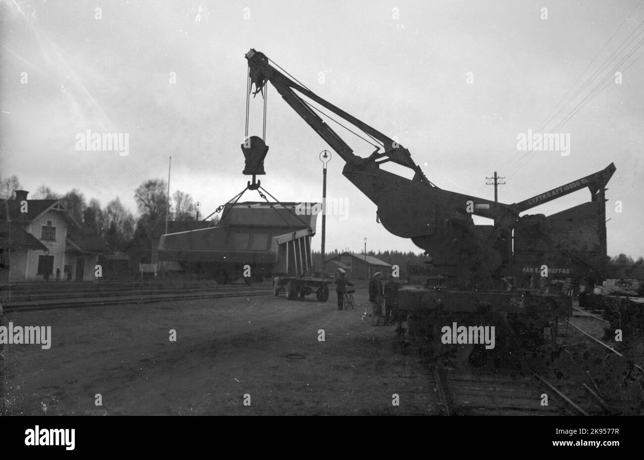 Machine loading Black and White Stock Photos & Images - Alamy