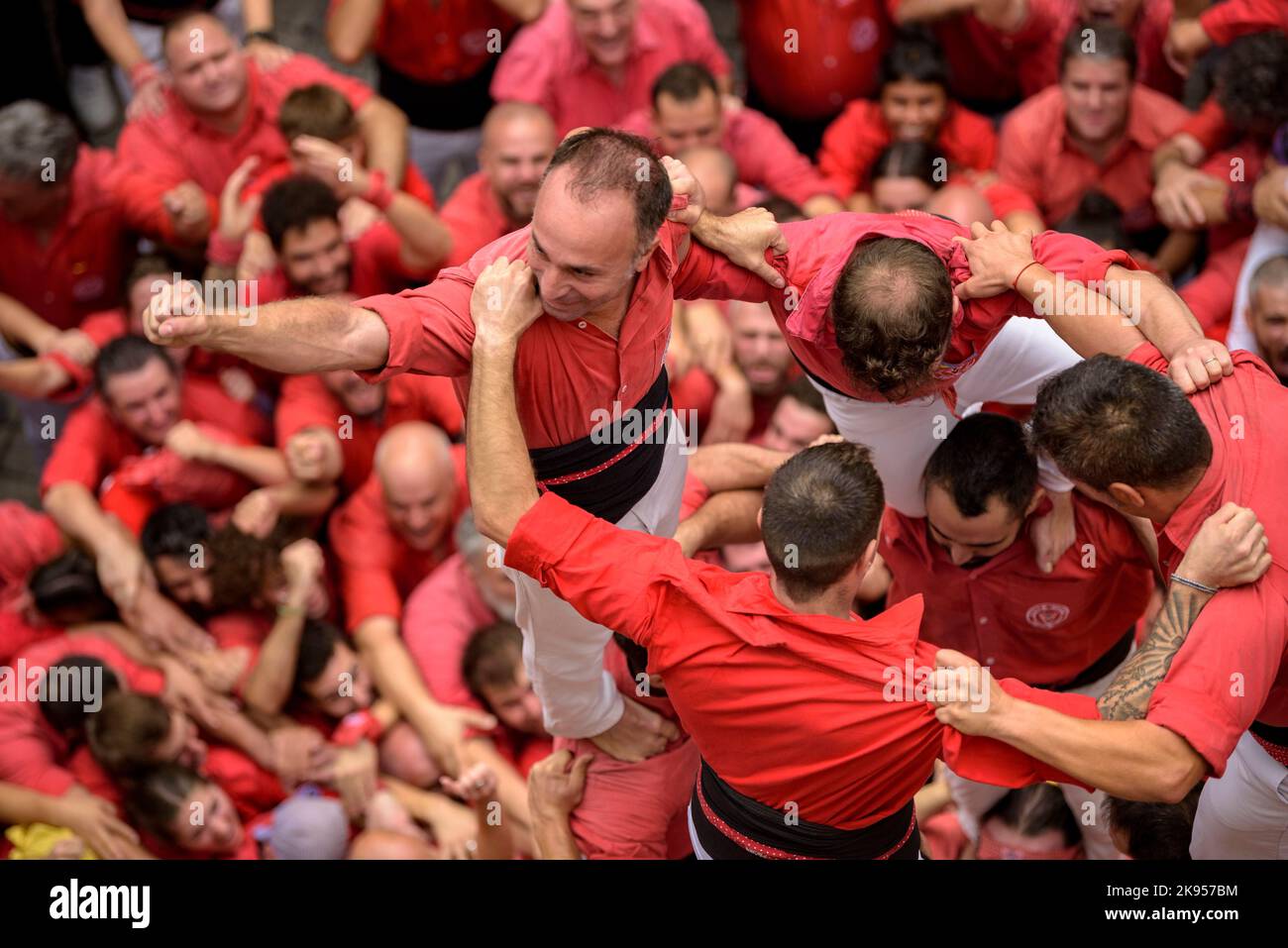 People of Colla Jove dels Xiquets de Valls celebrating after completing ...