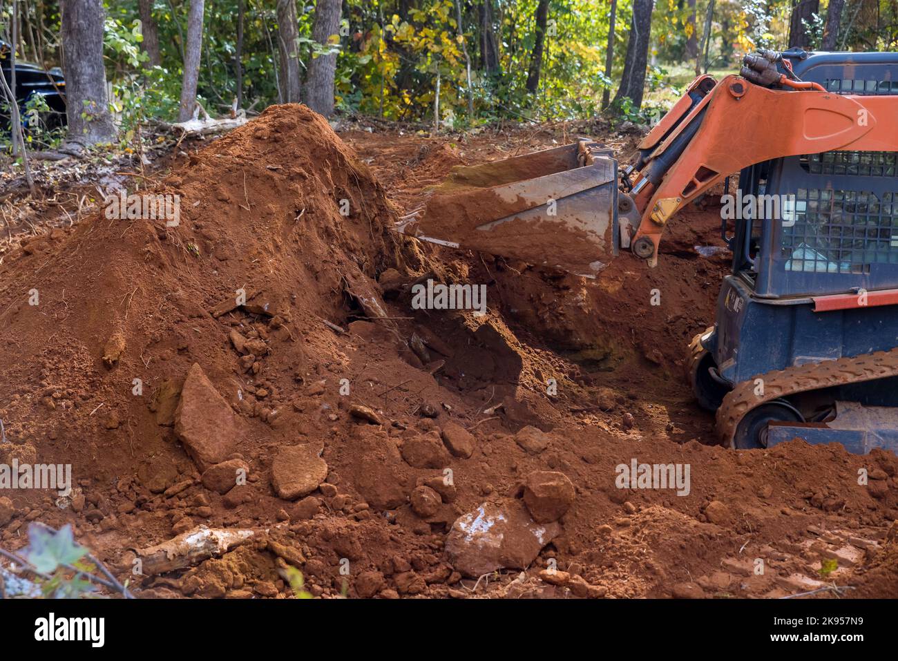 It is small tractor that is used for moving soil for landscaping ...