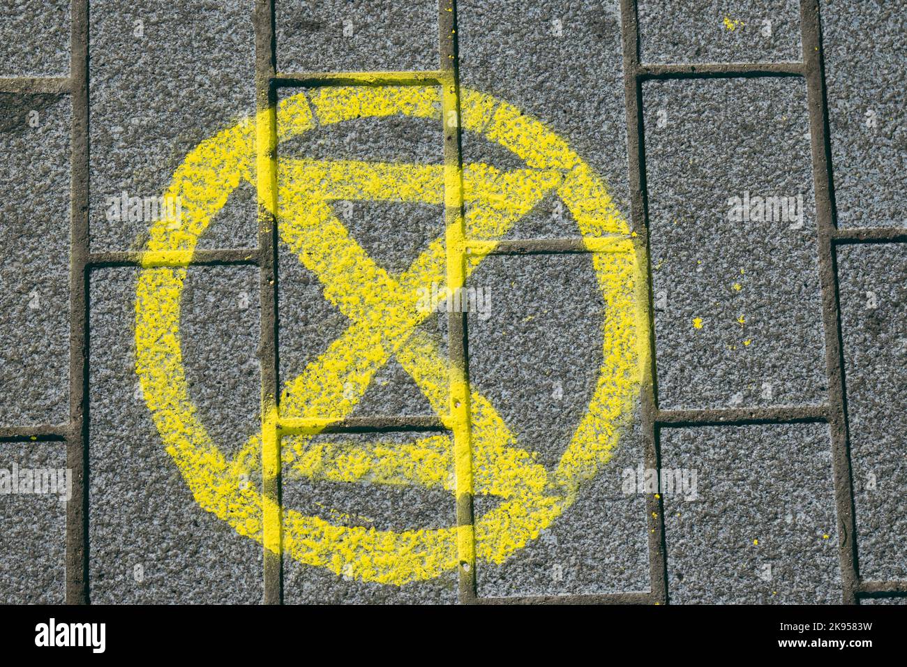 Extinction Rebellion symbol stencilled on Oxford pavement, England UK ...