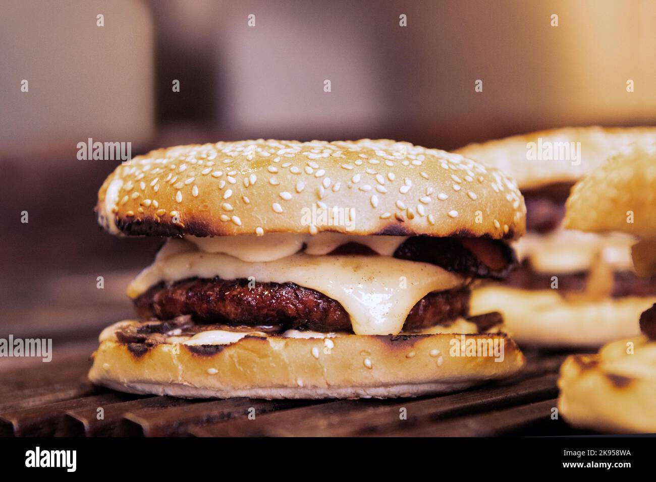 The burger with cheese on the grill Stock Photo - Alamy