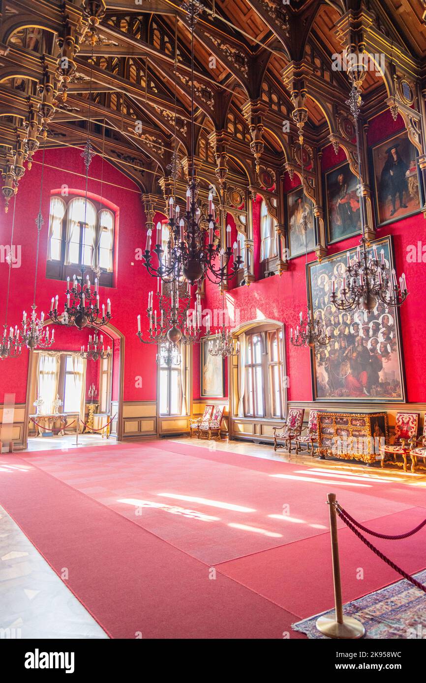 A room with furniture and portraits inside Miramare Castle near Trieste ...