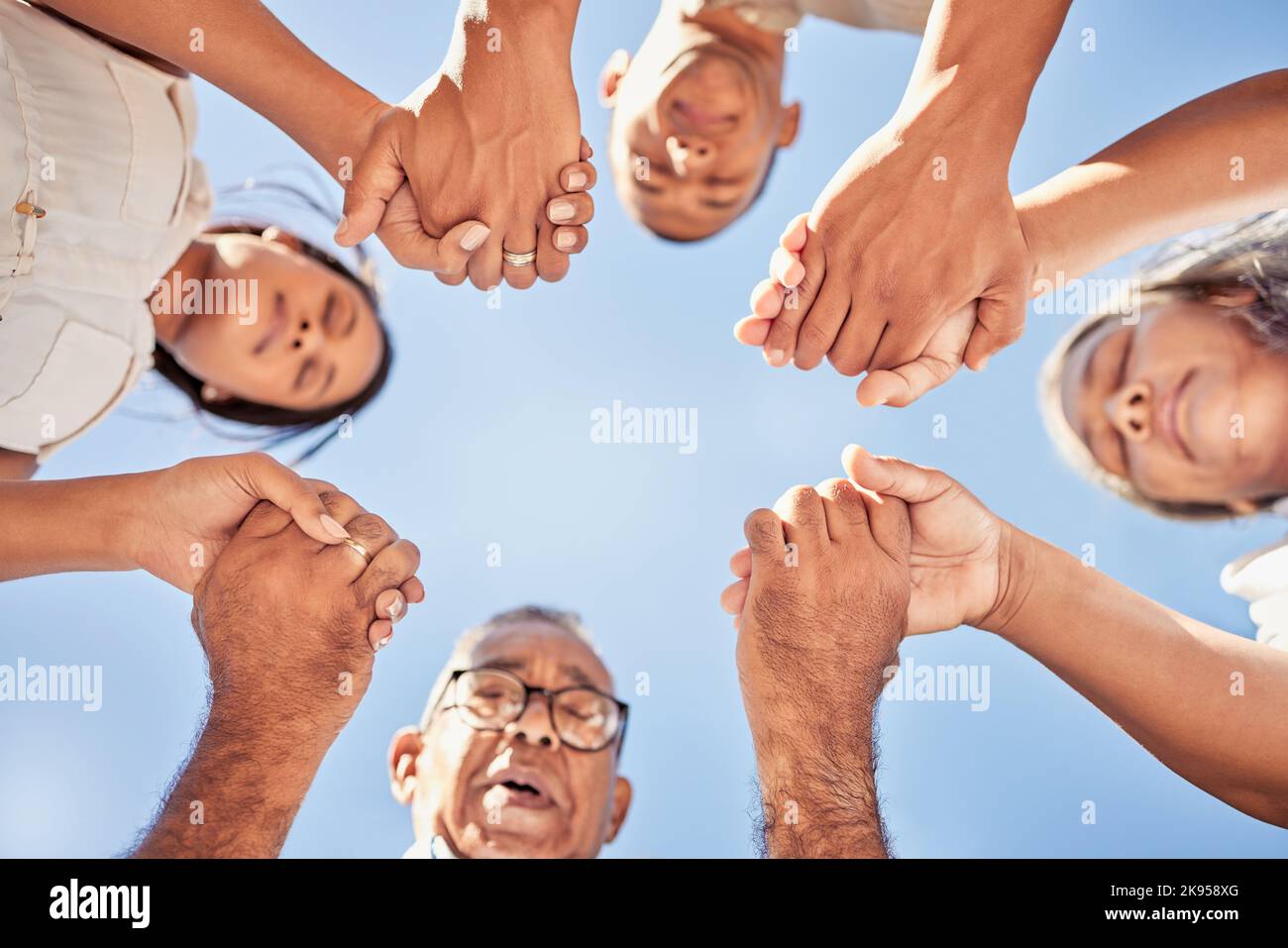 Worship, prayer and family holding hands praying together for higher ...