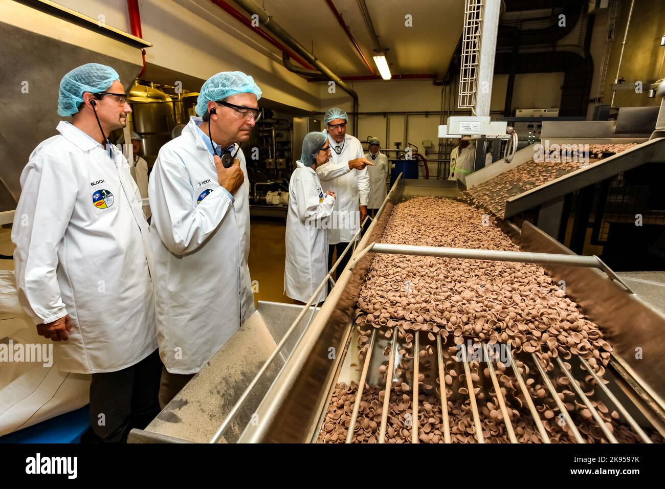 The male food technologist technicians checking production lines in a ...
