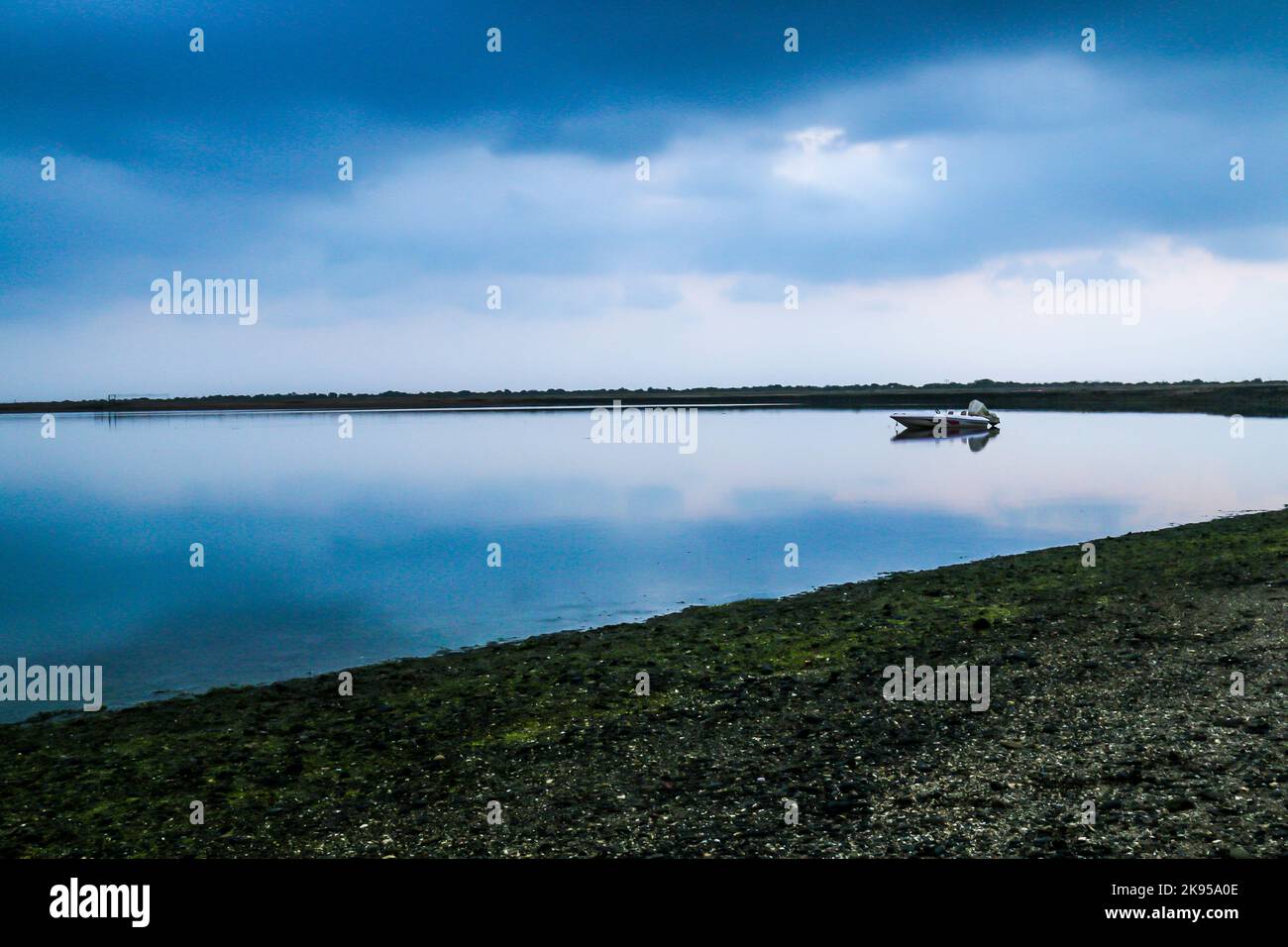 Speed boat parked in the back waters of Fujairah beach Stock Photo - Alamy