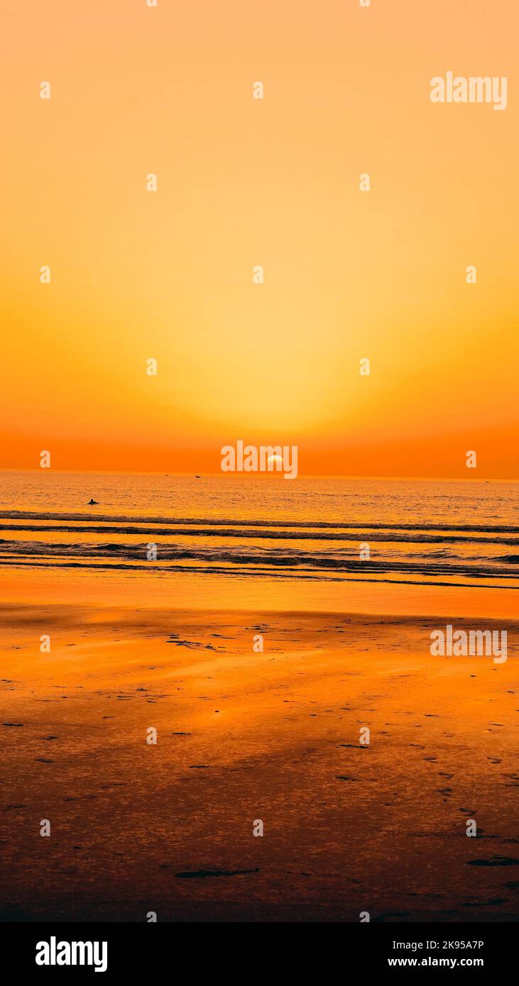 A vertical shot of the splendid sunset over the ocean Stock Photo - Alamy