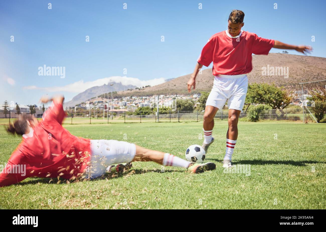 Soccer slide tackle hi-res stock photography and images - Alamy