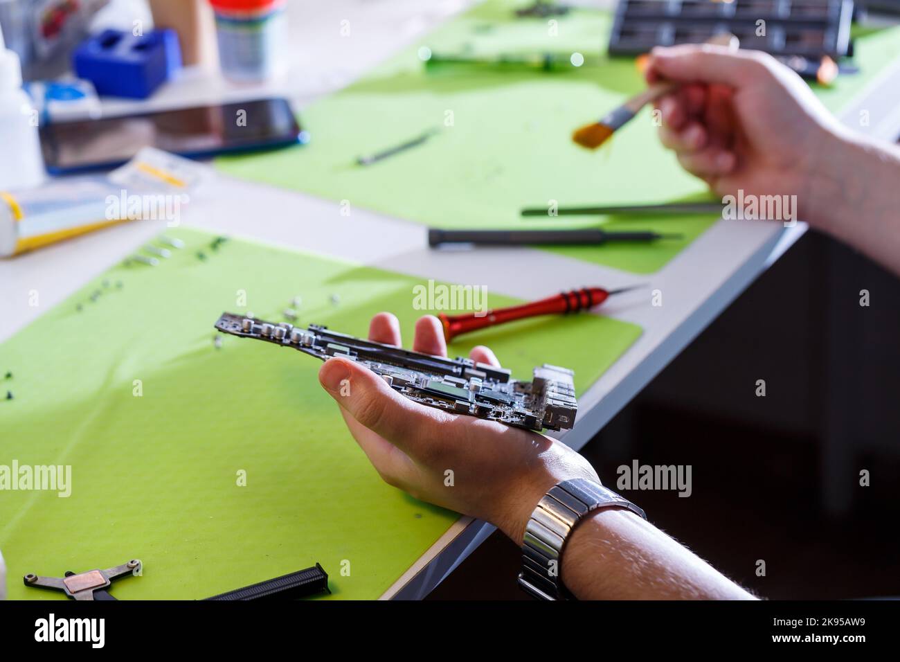 Professional computer and tablet repair shop or service. Close up of a ...