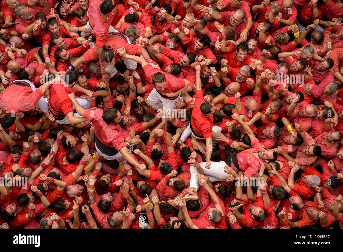People of Colla Jove dels Xiquets de Valls celebrating after completing ...