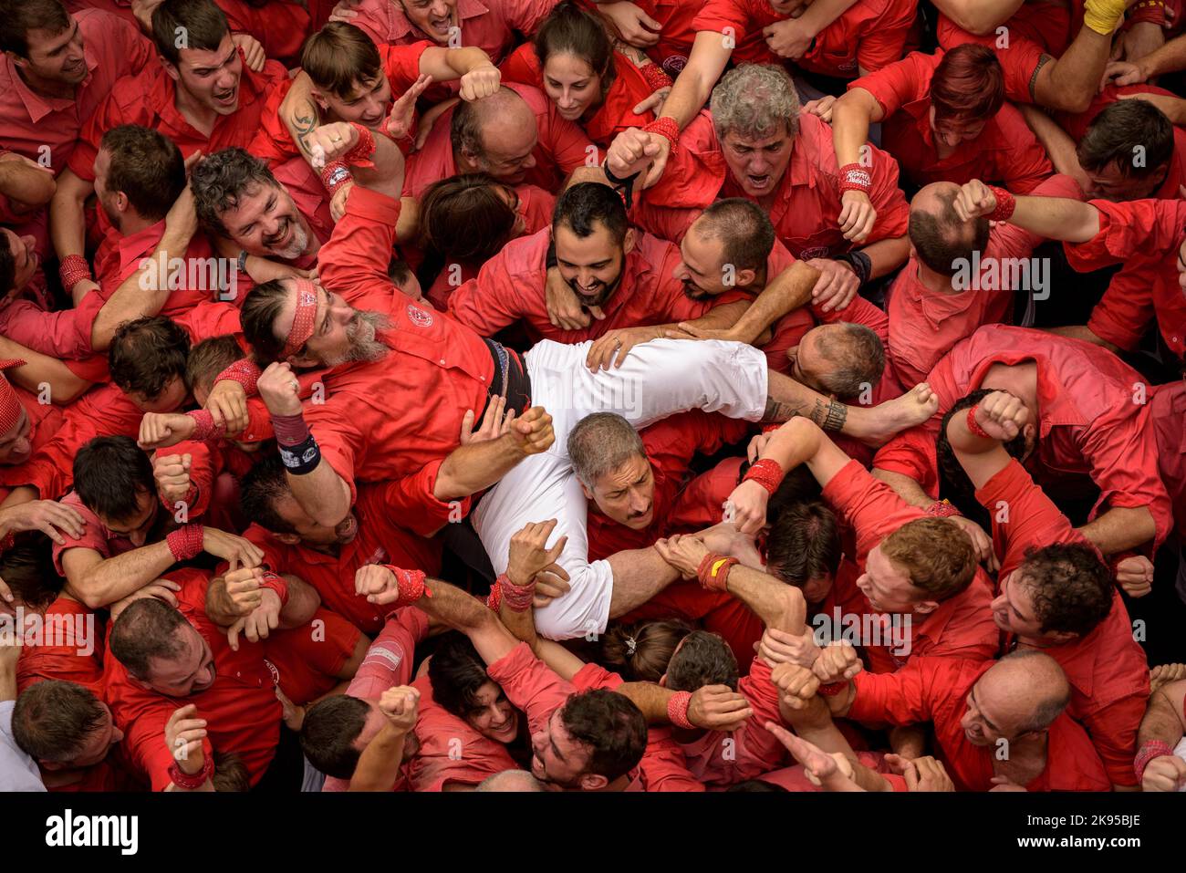People of Colla Jove dels Xiquets de Valls celebrating after completing ...