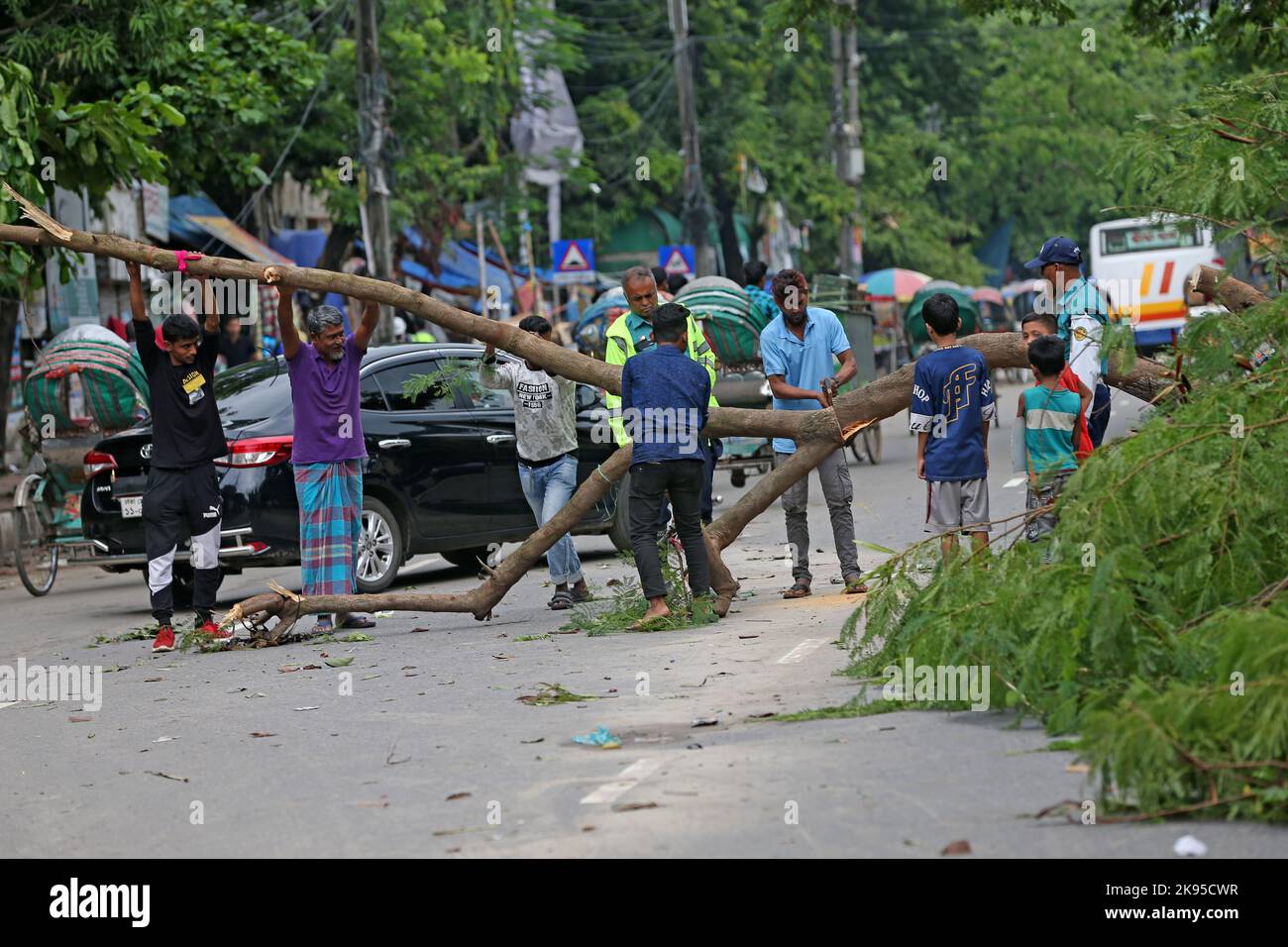 The gusty winds of Cyclone Sitrang uprooted trees in various parts of ...