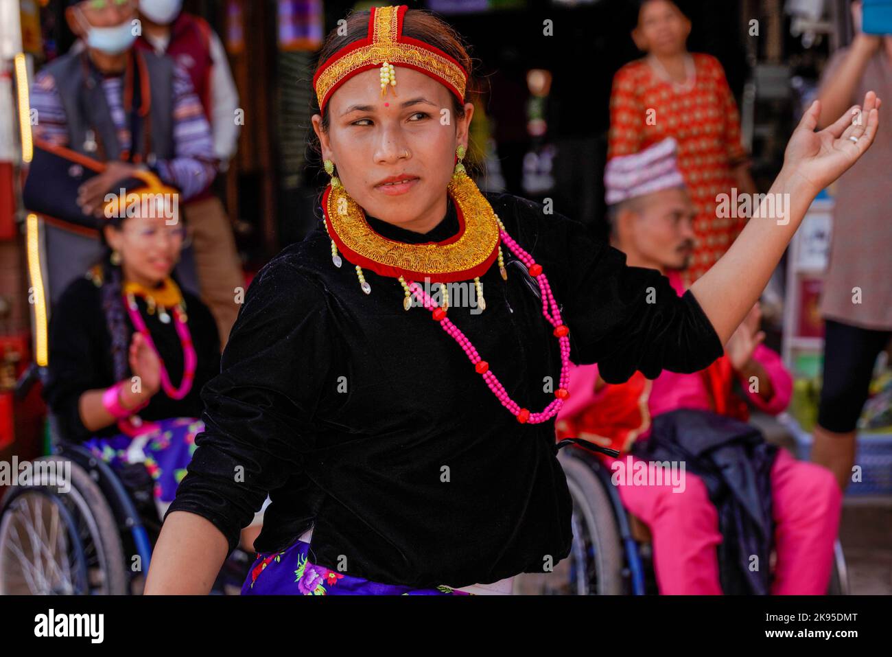 Persons with disabilities and impairments dance and sing to the Deusi ...
