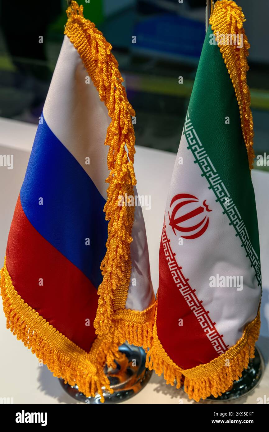 Russian and Iranian flags on the table. The concept of bilateral ...