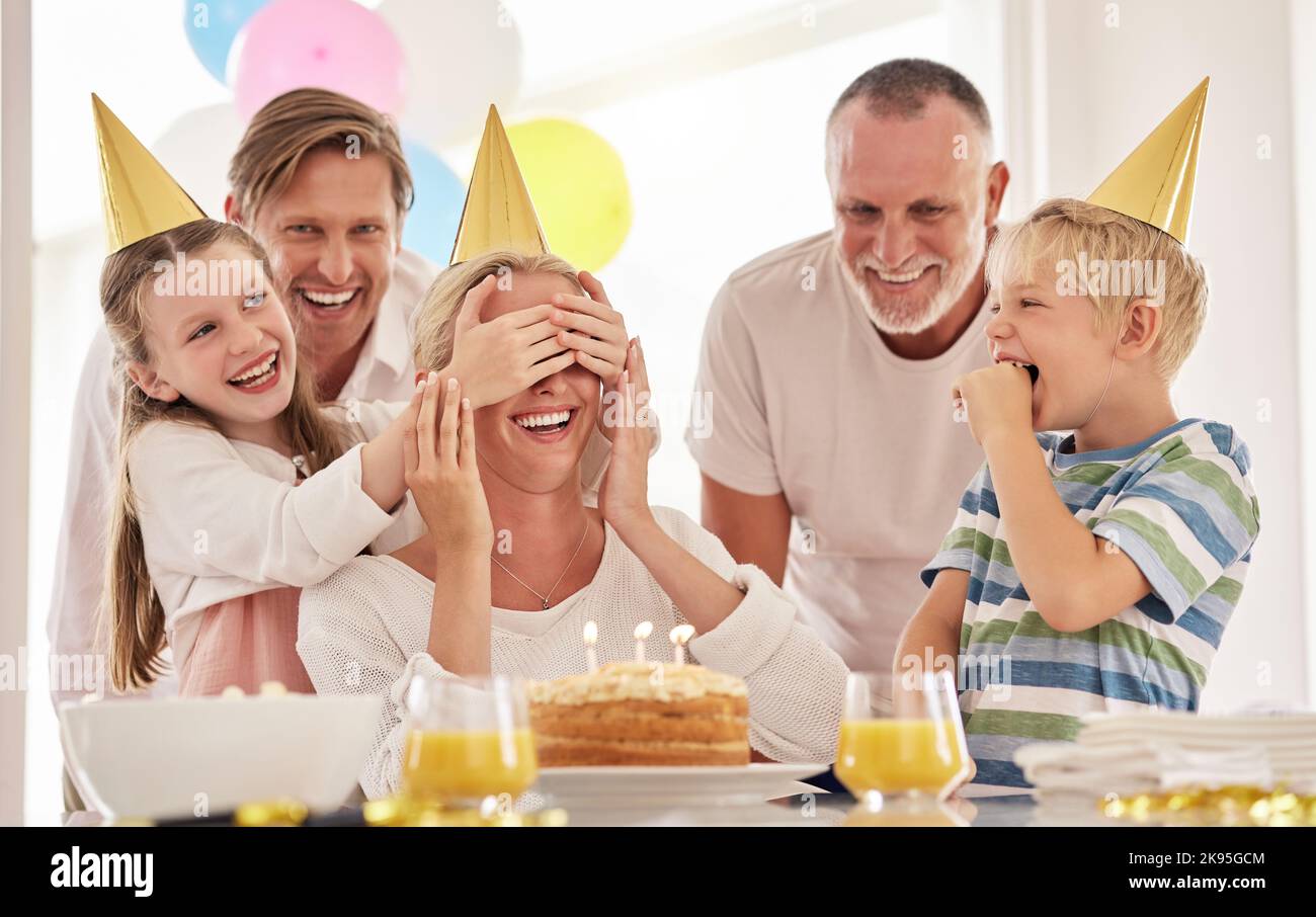 Surprise, mother birthday and family celebrate at a party at home with ...