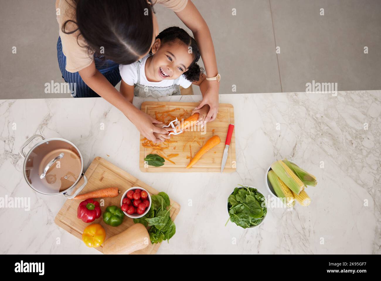 Development, child and mother in kitchen, vegetables and learn cooking ...