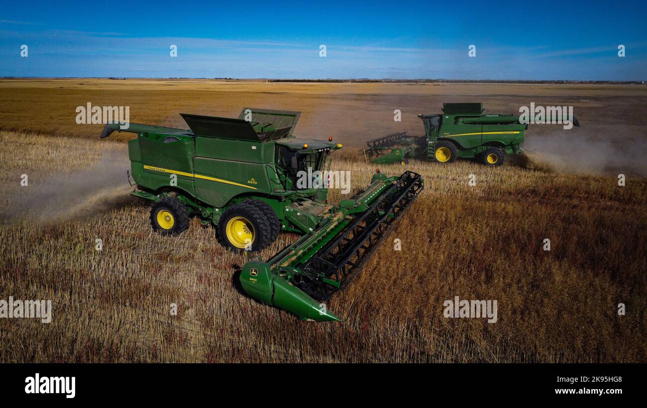 Combines at work Stock Photo - Alamy