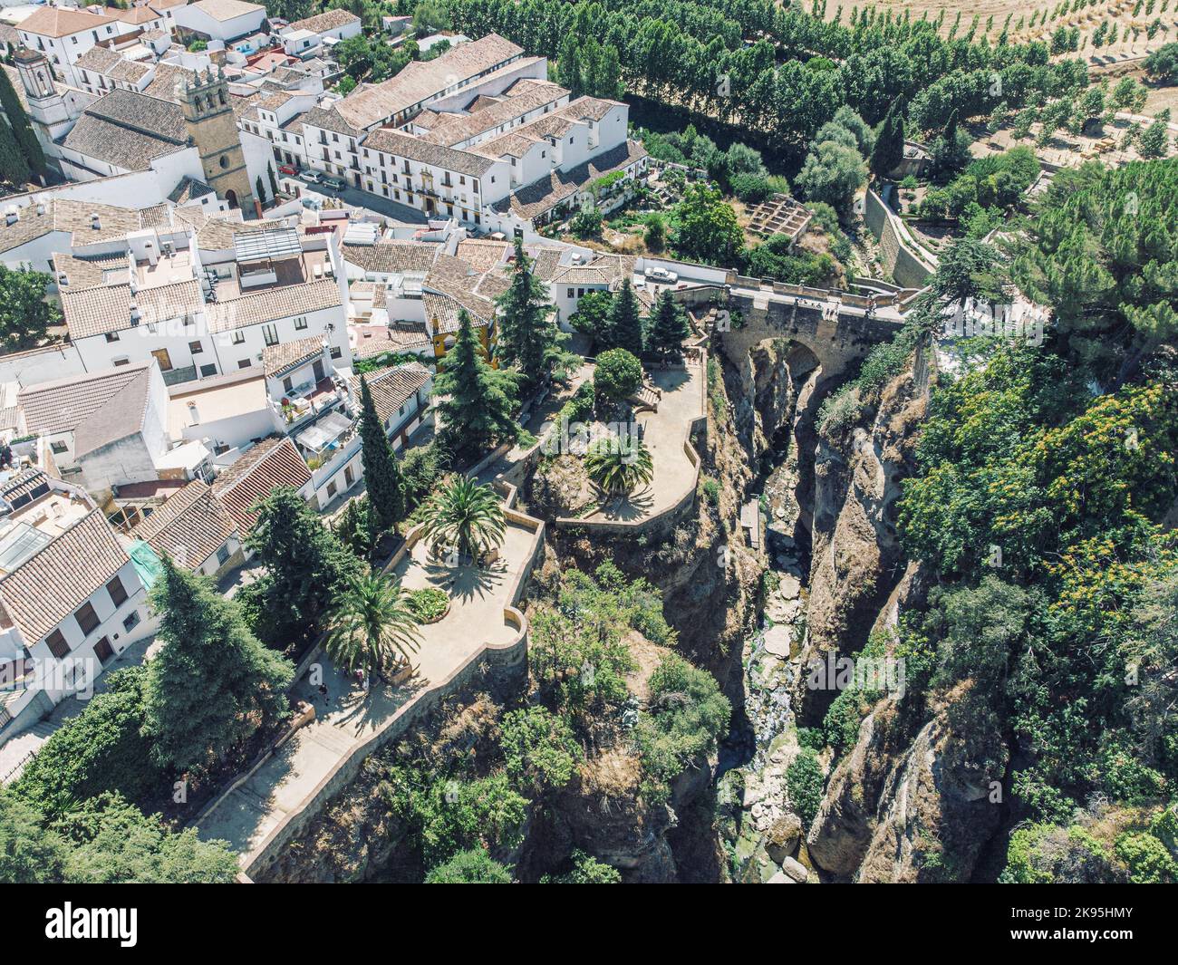 An aerial shot of the Ronda with Puente Nuevo Bridge in Spain bridge with the river canyon in ...