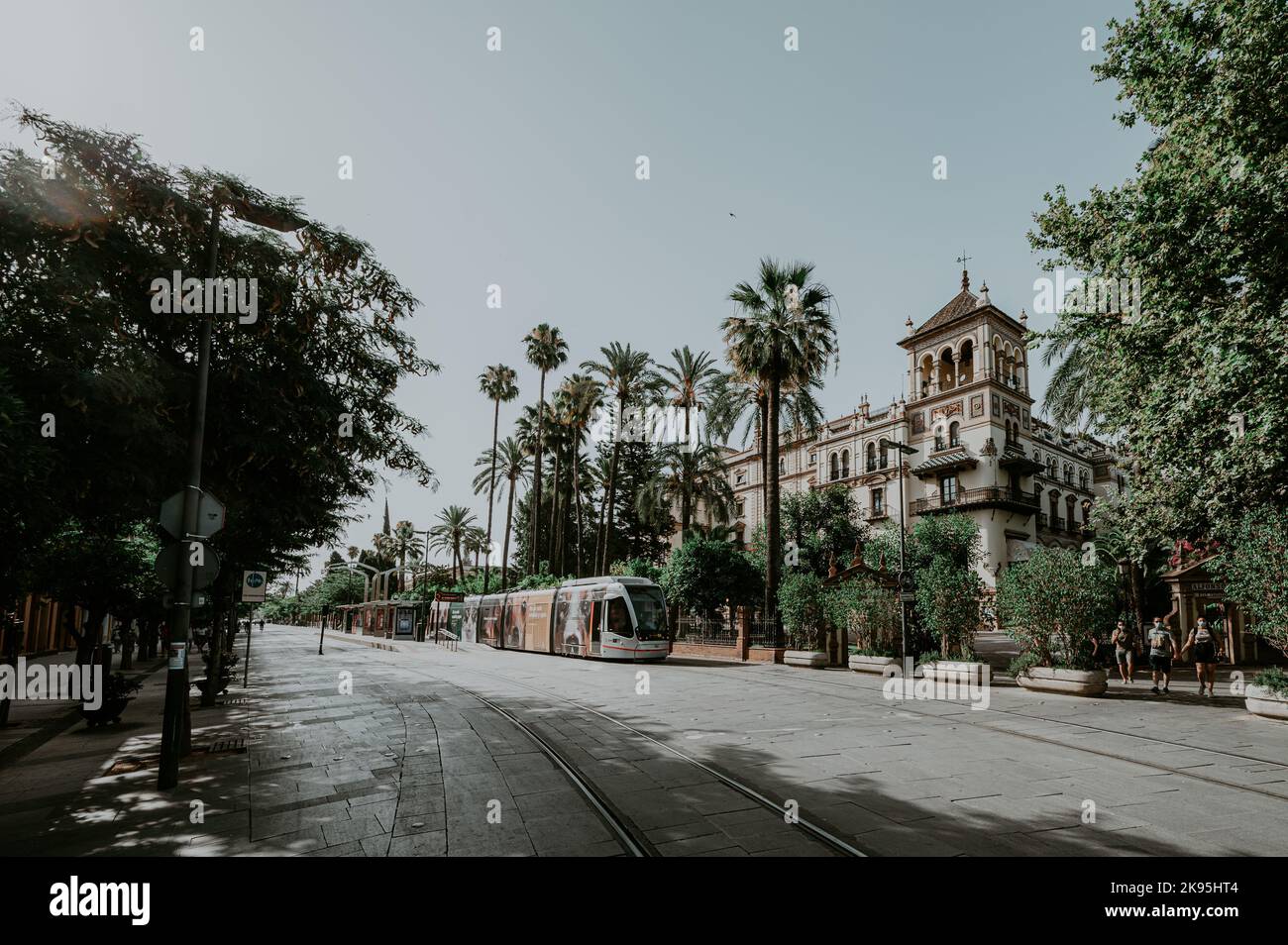 An ancient palace surrounded by palm trees in Sevilla, Andalusia, Spain ...